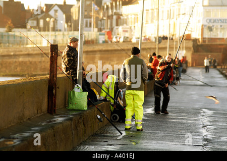 Fishing from Harbour wall at Bridlington East Yorkshire UK Stock Photo ...