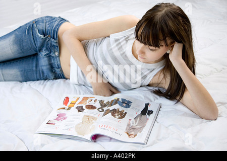 Teenage Girl Reading Magazine Model Released Stock Photo - Alamy