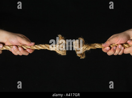 Hands and breaking rope Stock Photo - Alamy