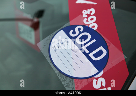 used car sold sign second hand car sales Stock Photo - Alamy