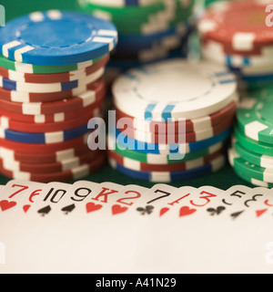 Closeup of poker player with playing cards and chips Stock Photo - Alamy