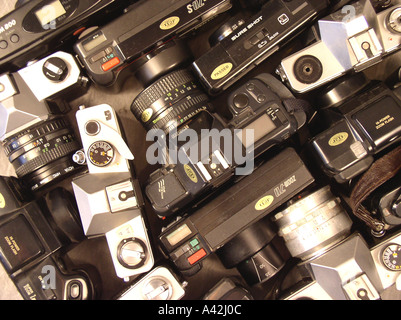 Pile of broken redundant old cameras SLR single les reflex cameras ...