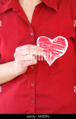 Woman hands holding Valentine's Day gift box on red background. Top ...