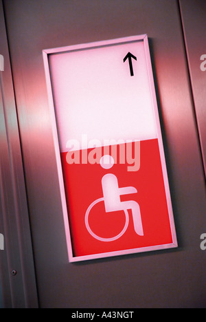 Close-up of handicapped elevator sign on wall Stock Photo - Alamy