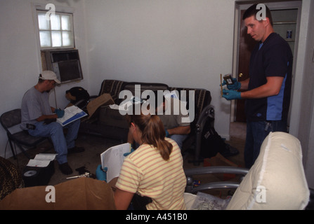 Police officers doing paperwork and gathering evidence after search ...