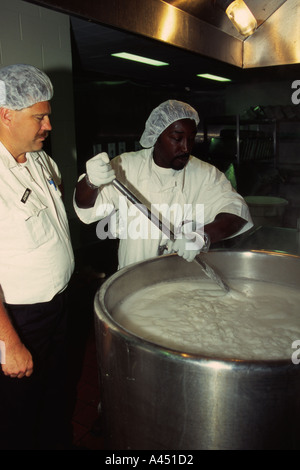 Inmate working in the kitchen. Correctional Officer supervising ...