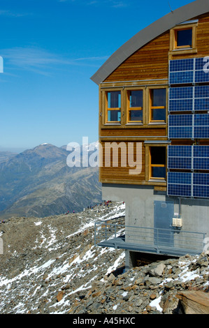 Modern mountain hut Refuge de Tete Rousse at the ascent of Mt. Blanc ...