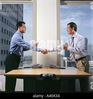 Businessmen shaking hands. Top View Stock Photo - Alamy