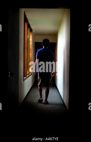 man walking down the hallway inside a new building Stock Photo - Alamy