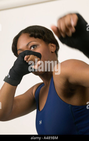 Mid adult woman practicing boxing in a boxing ring Stock Photo - Alamy