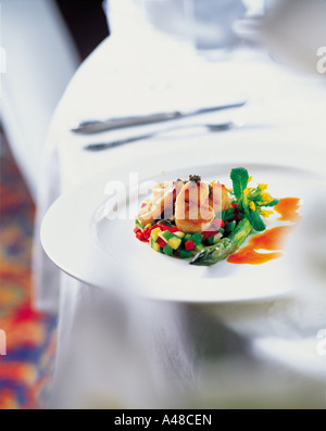 Vertical high angle shot of meat and vegetables in a black pot on a ...