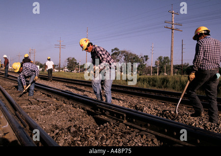 railway maintenance crew laying railway lines iowa usa Stock Photo - Alamy