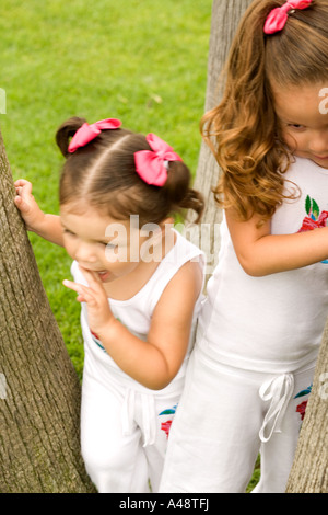 Cute kid girl stand on wooden floor and paper planes flying around ...