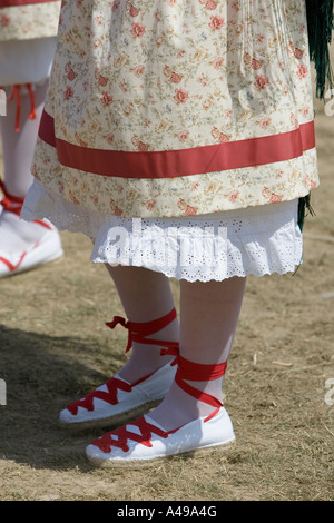 Basque girls performing traditional Basque folk dance holding apples in ...