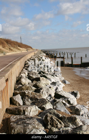 Shingle beach and large sea wall providing coastal defence at Chiswell ...