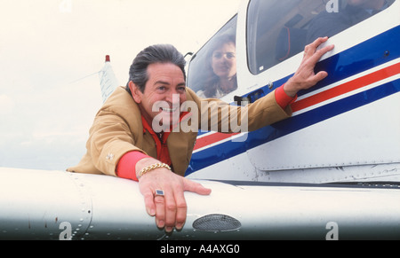 Actor Patrick Mower Emmerdales Rodney Blackstock hanging onto a light ...