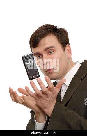 Catching a call Young businessman trying to catch a cell phone Stock ...