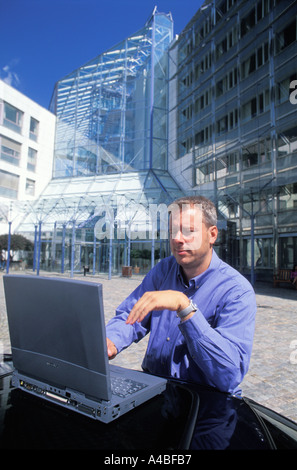 BUSINESS MAN WITH A LAPTOP MODEL RELEASED Stock Photo - Alamy