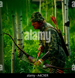 Bow hunter in a forest setting Stock Photo - Alamy