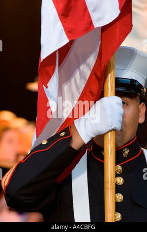 A member of the United States Color Guard makes adjustments to the US ...