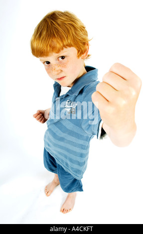 Young boy punching forward in to the air Strike, punch, power Stock ...
