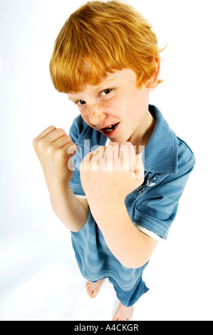Young boy punching forward in to the air Strike, punch, power Stock ...