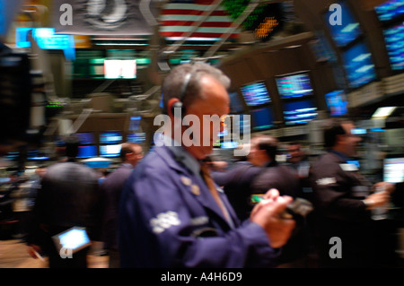 Stockbrokers busy on the trading floor of the New York Stock Exchange ...
