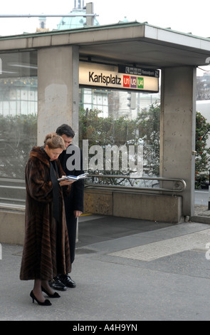 Couple check a tourist map at Karlsplatz Vienna Austria Stock Photo - Alamy