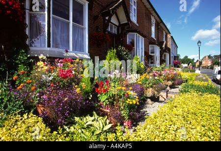 UK Cheshire Malpas village flower filled front garden of terraced house ...