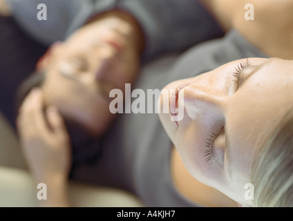 Man Sleeping On Woman's Lap Stock Photo - Alamy