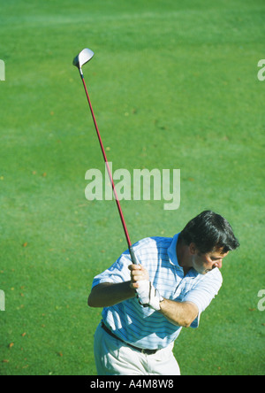 A golfer swinging a golf club, overhead view Stock Photo - Alamy