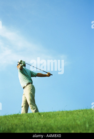 A golfer stretching Stock Photo - Alamy