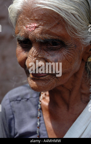 Tired Indian poor woman Stock Photo - Alamy