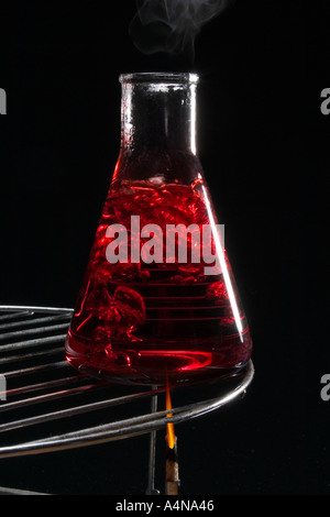Water boiling in lab flask over bunsen burner Stock Photo - Alamy