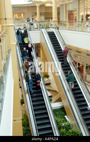 Escalators move shoppers in a large mall complex Stock Photo - Alamy