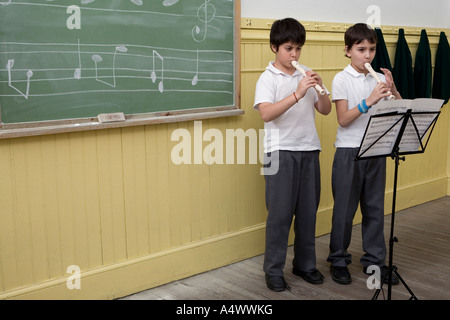 Young students learning to play the recorder Stock Photo - Alamy