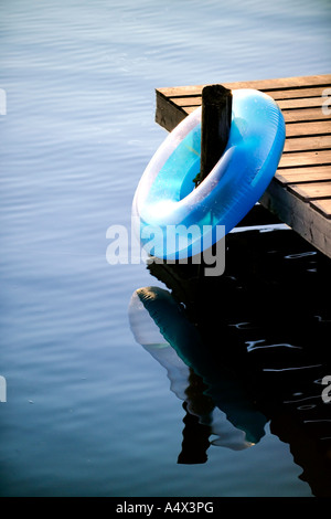 Dock and inner tube on a Lake Stock Photo - Alamy