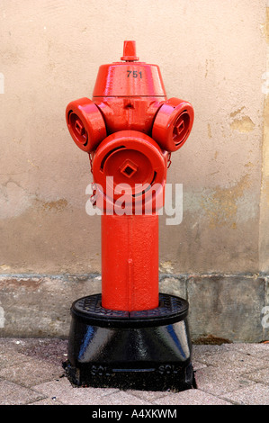 A vertical shot of a red fire hydrant water pipe near the road Stock ...