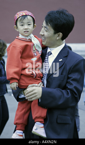 CHINA BEIJING Proud Chinese father poses for a photo with his son at ...
