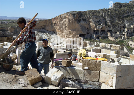 Stone masons at work building structure in Cappadocia Turkey Stock ...