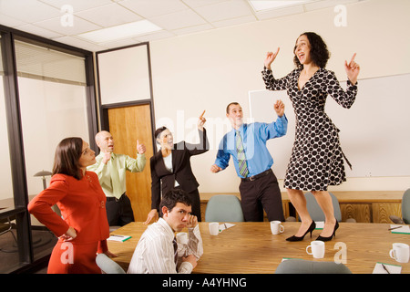 Businesspeople acting silly in office Stock Photo - Alamy