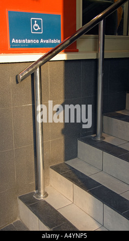 ASSISTANCE AVAILABLE Sign outside high street store indicating that ...