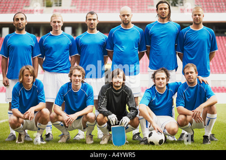 Asian football player man in a blue jersey celebrates the victory on ...