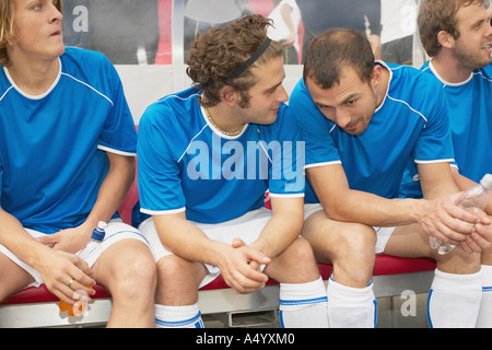 Footballers on the bench Stock Photo - Alamy