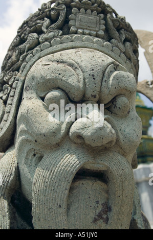 A closeup of a warrior statue at the Grand Palace in Bangkok, Thailand ...