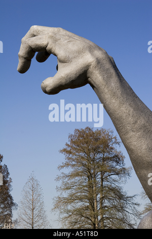 Hand emerging from the earth Stock Photo - Alamy