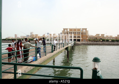 people on dock in kuwait city Stock Photo - Alamy