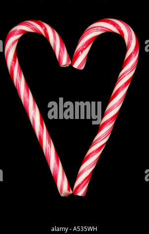 Two candies canes striped in Christmas colours. Isolated Stock Photo ...
