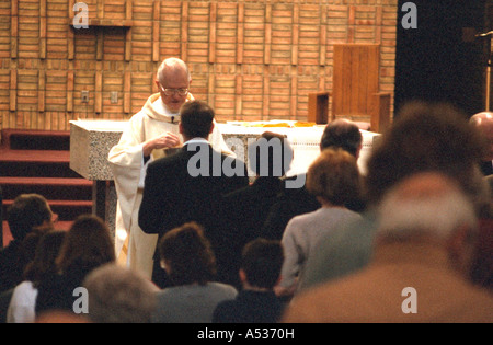 Priests performing communion. St. Alphonsus Catholic Church Brooklyn ...