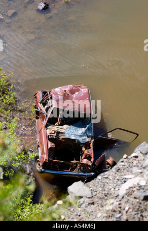 Rusty old car half submerged into the sand of a desert, Car wrecks of ...